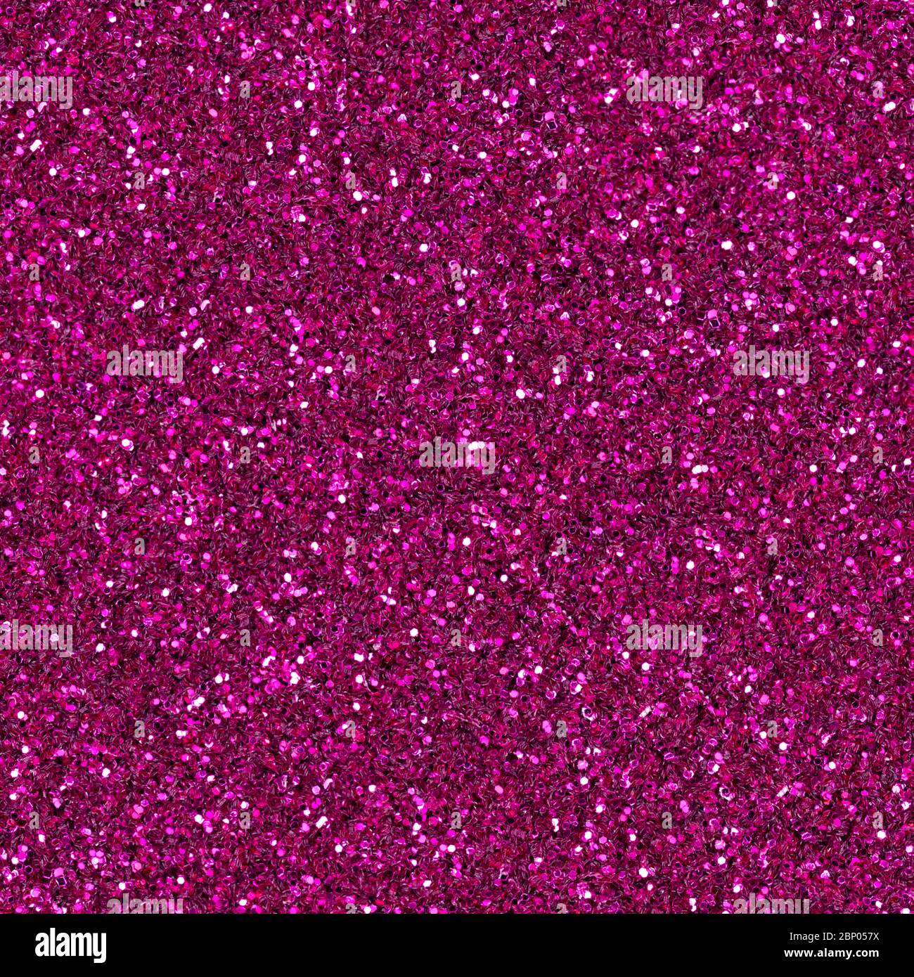 Bright red, purple, fuchsia, magenta glitter, sparkle confetti texture. Christmas abstract ...
