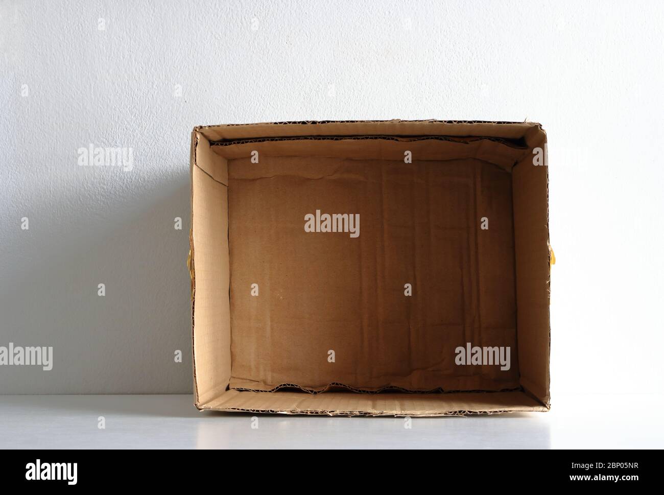 Closeup and selective focus on bottom of an empty cardboard box under ...