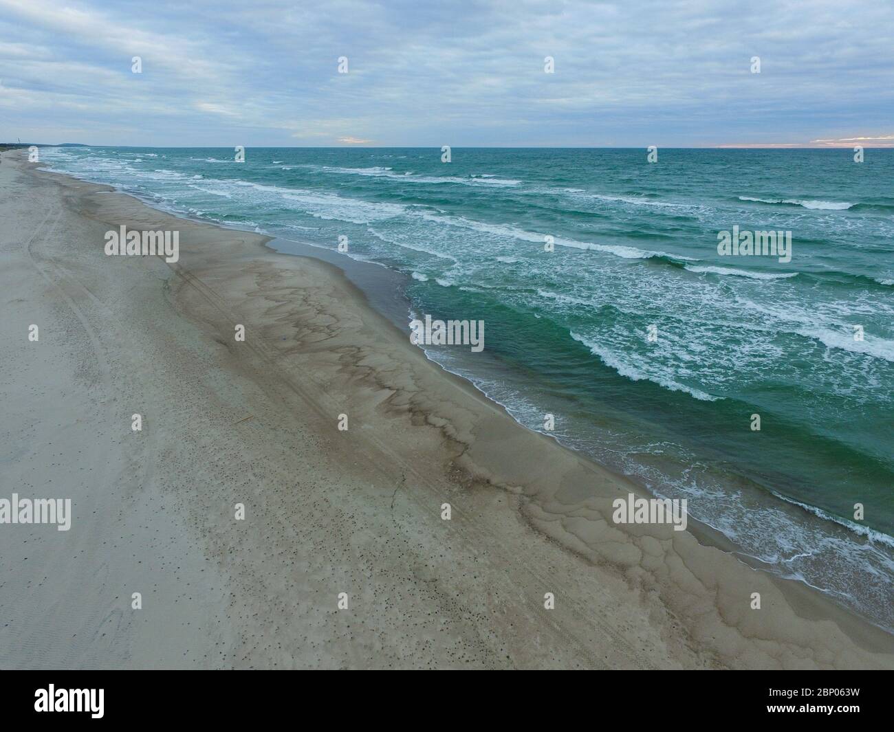 Top view of cold stormy and harsh Baltic sea. Empty off-season beach ...