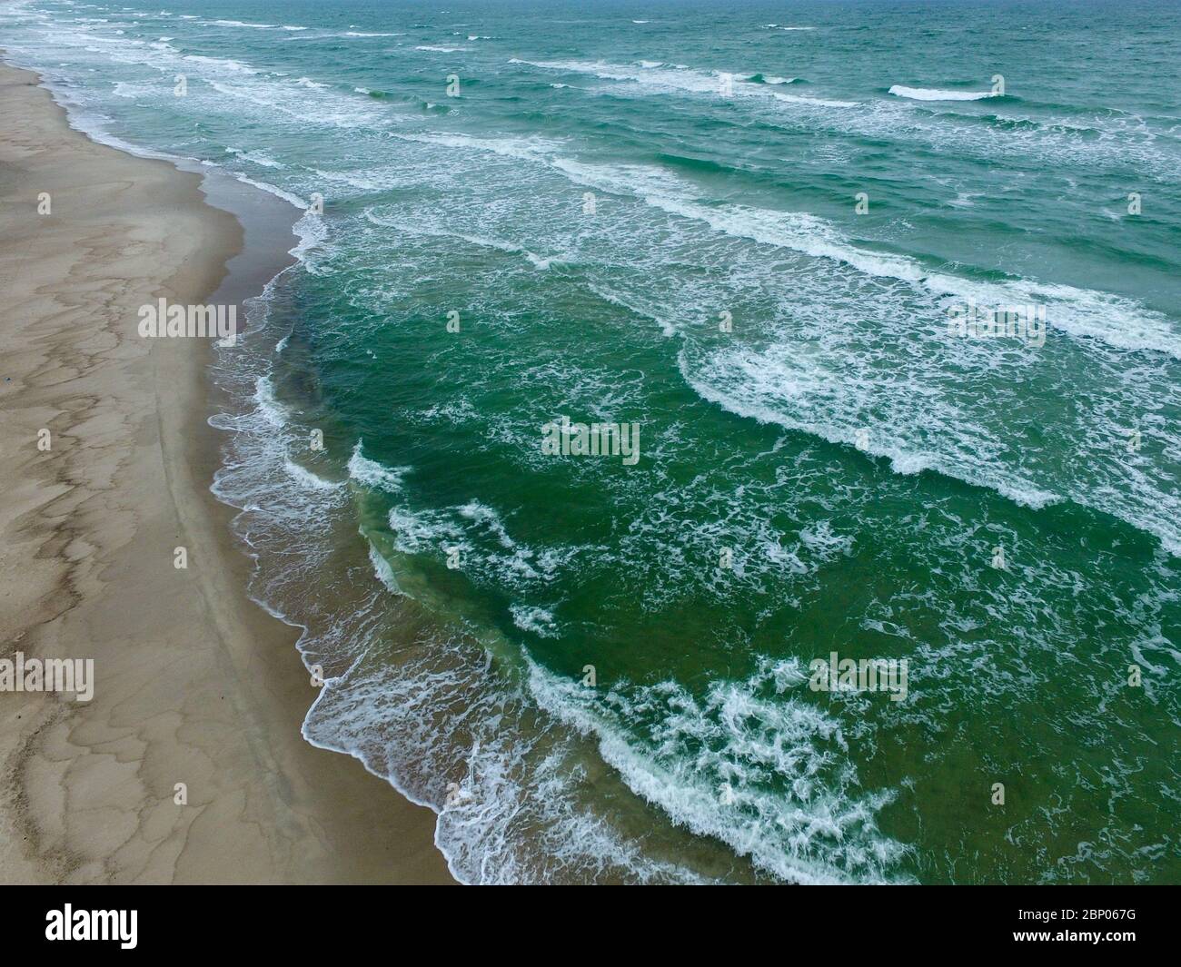 Top view of cold stormy and harsh Baltic sea. Empty off-season beach ...
