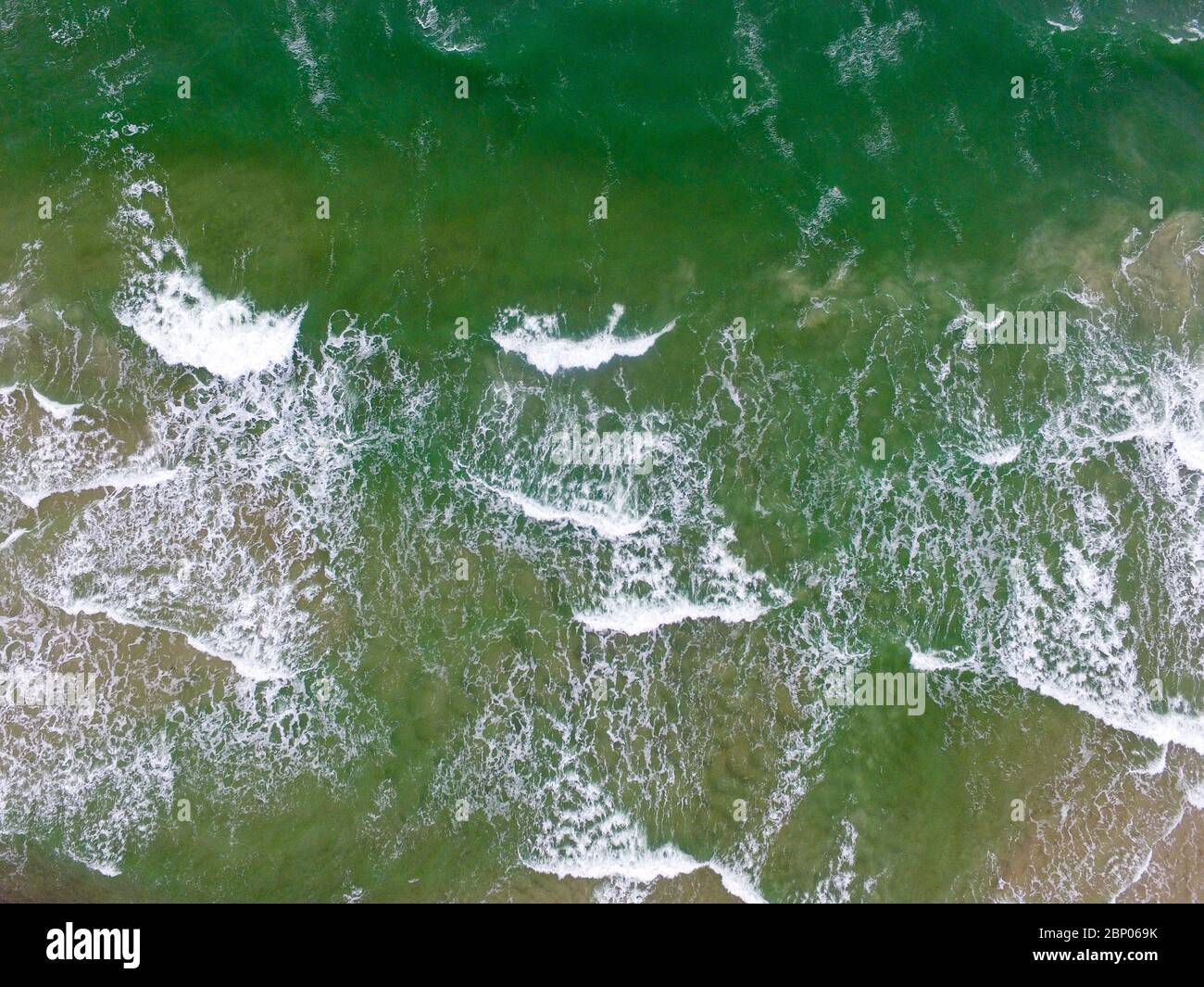 Top view of cold stormy and harsh Baltic sea. Empty off-season beach ...