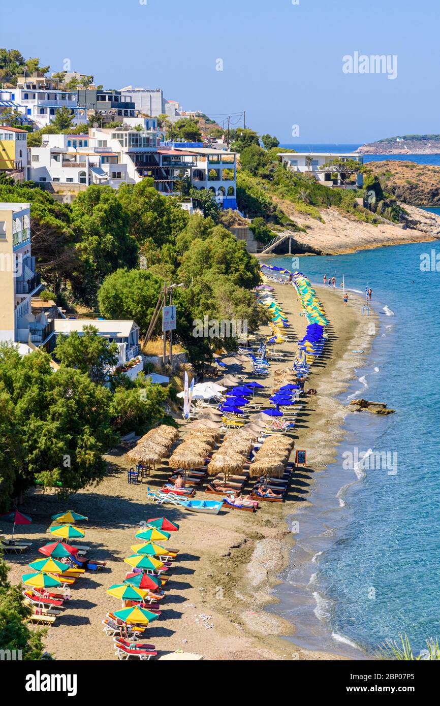 Summer on a Greek beach at the pretty town of Masouri Beach, Kalymnos ...