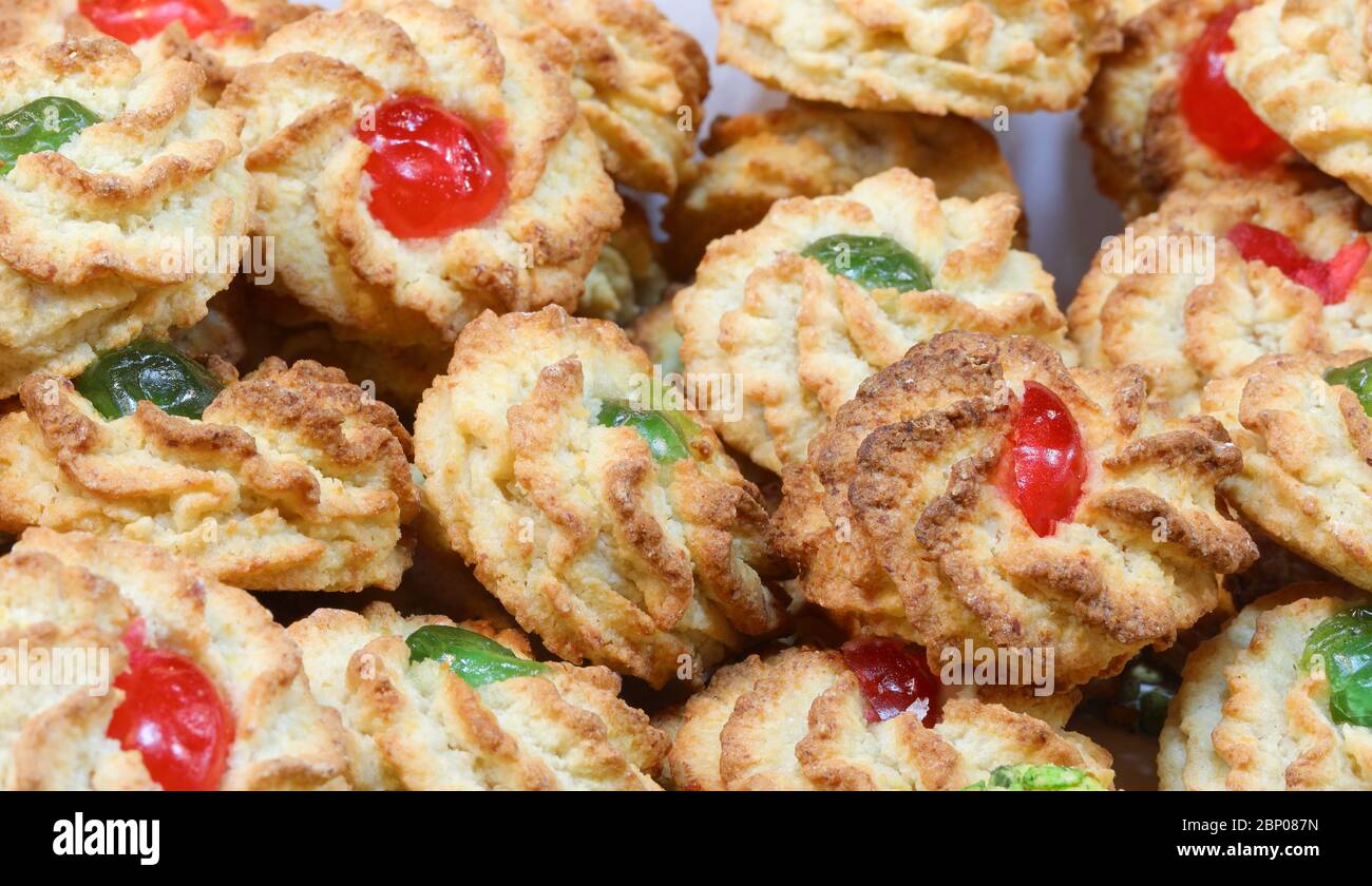 background of dried biscuits with candied cherry on top Stock Photo - Alamy