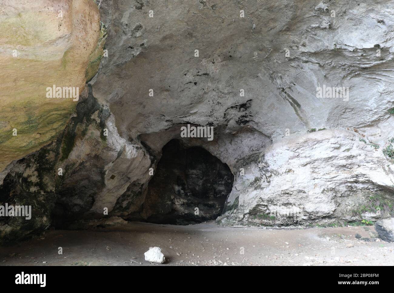 interior of an ancient large cave in the rock used as a dwelling by ...