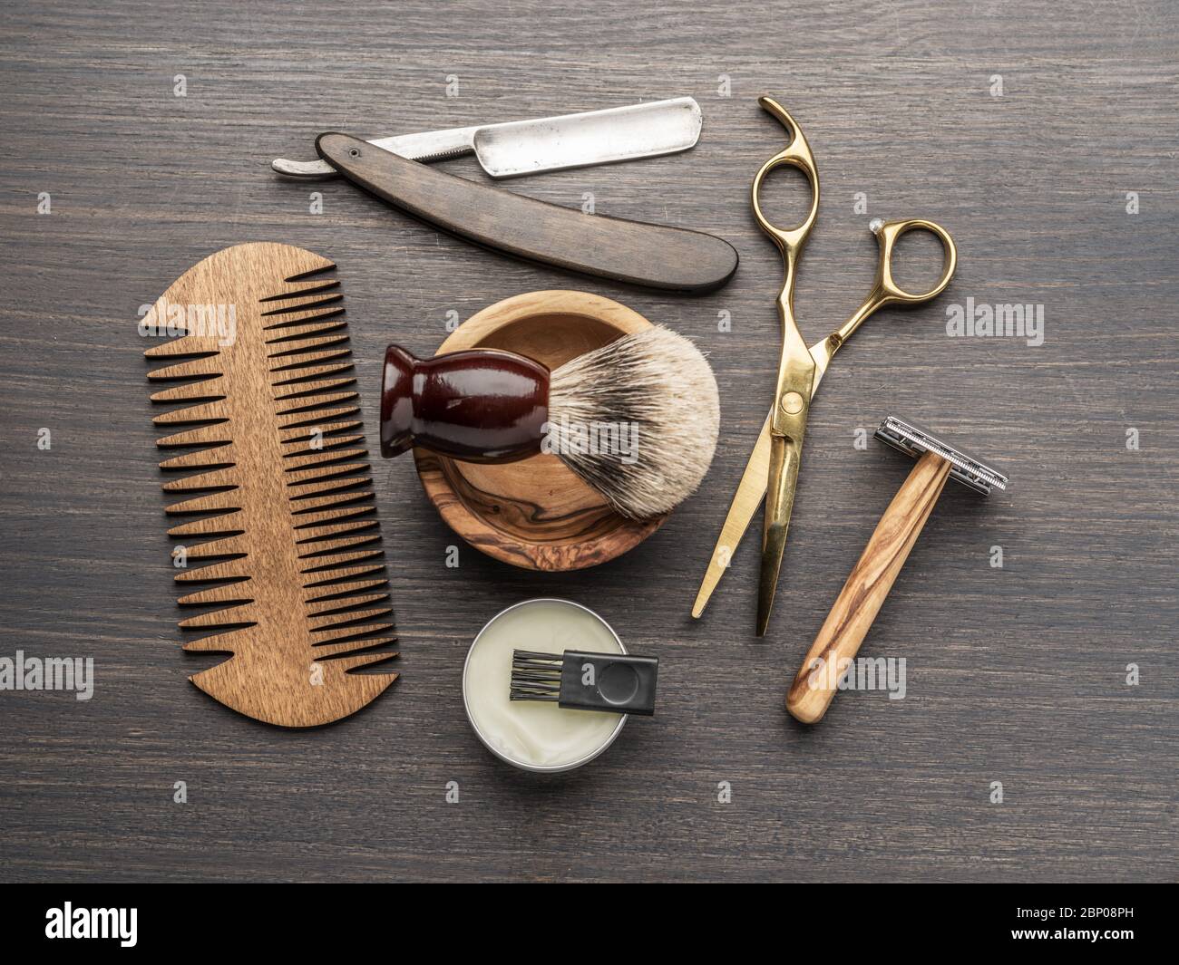 Classic grooming and hairdressing tools on wooden background. Top view ...