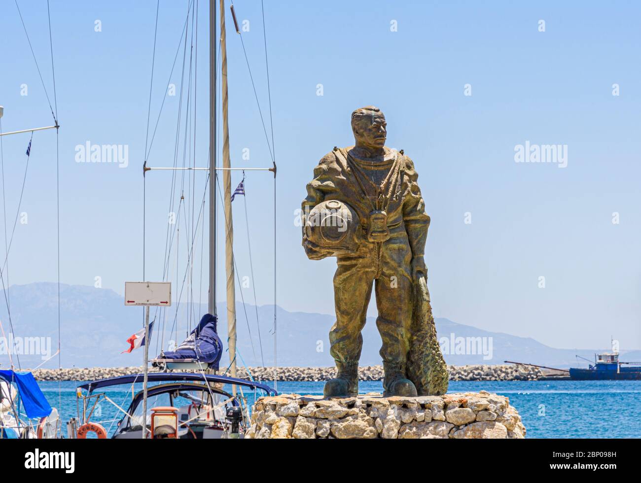 Sponge diver statue on the waterfront of Pothia Town, Kalymnos ...
