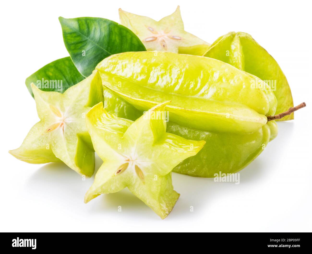 Carambola fruit with slice of star fruit and leaves isolated on a white ...