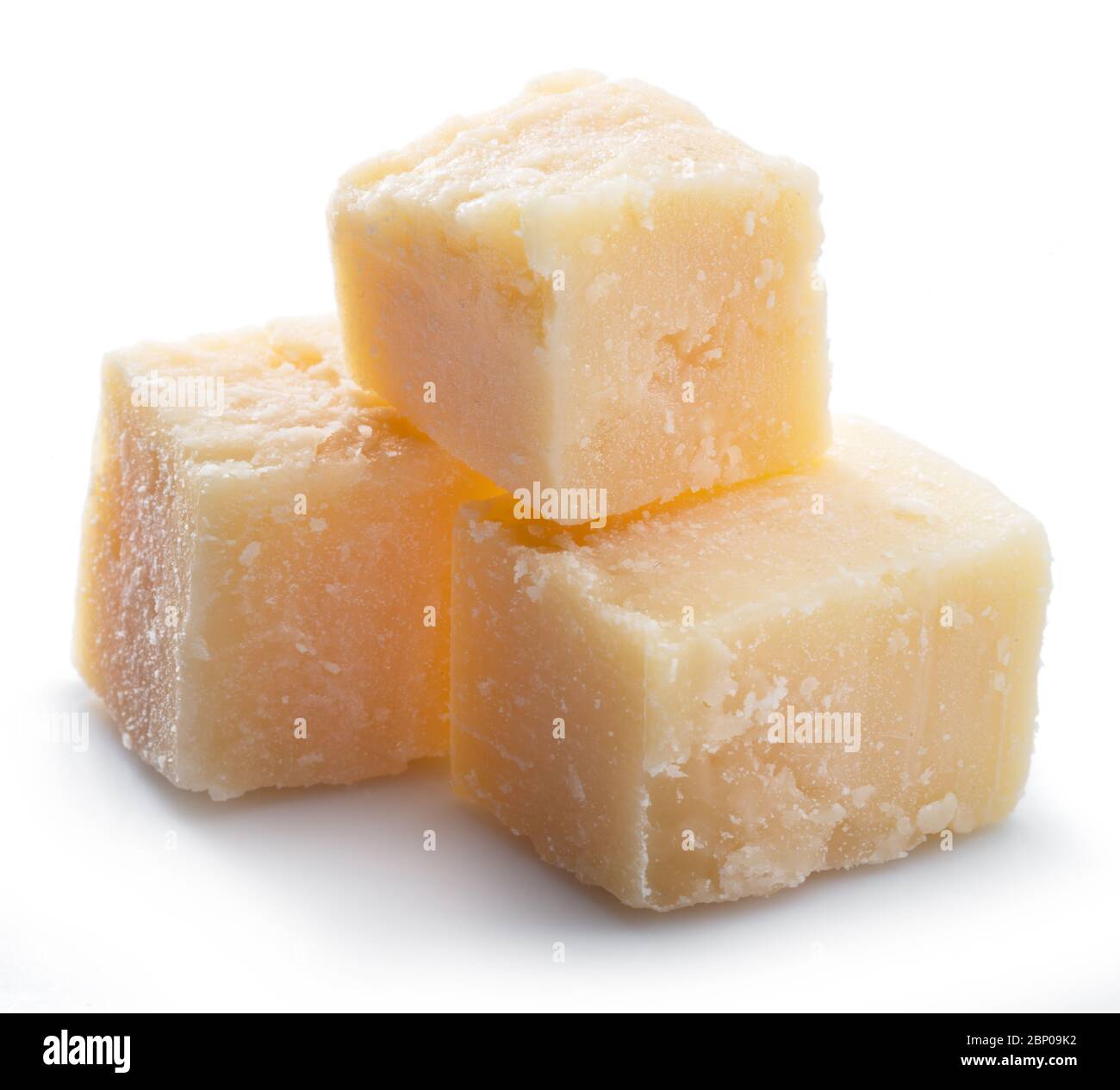 Parmesan cheese cubes isolated on white background Stock Photo - Alamy