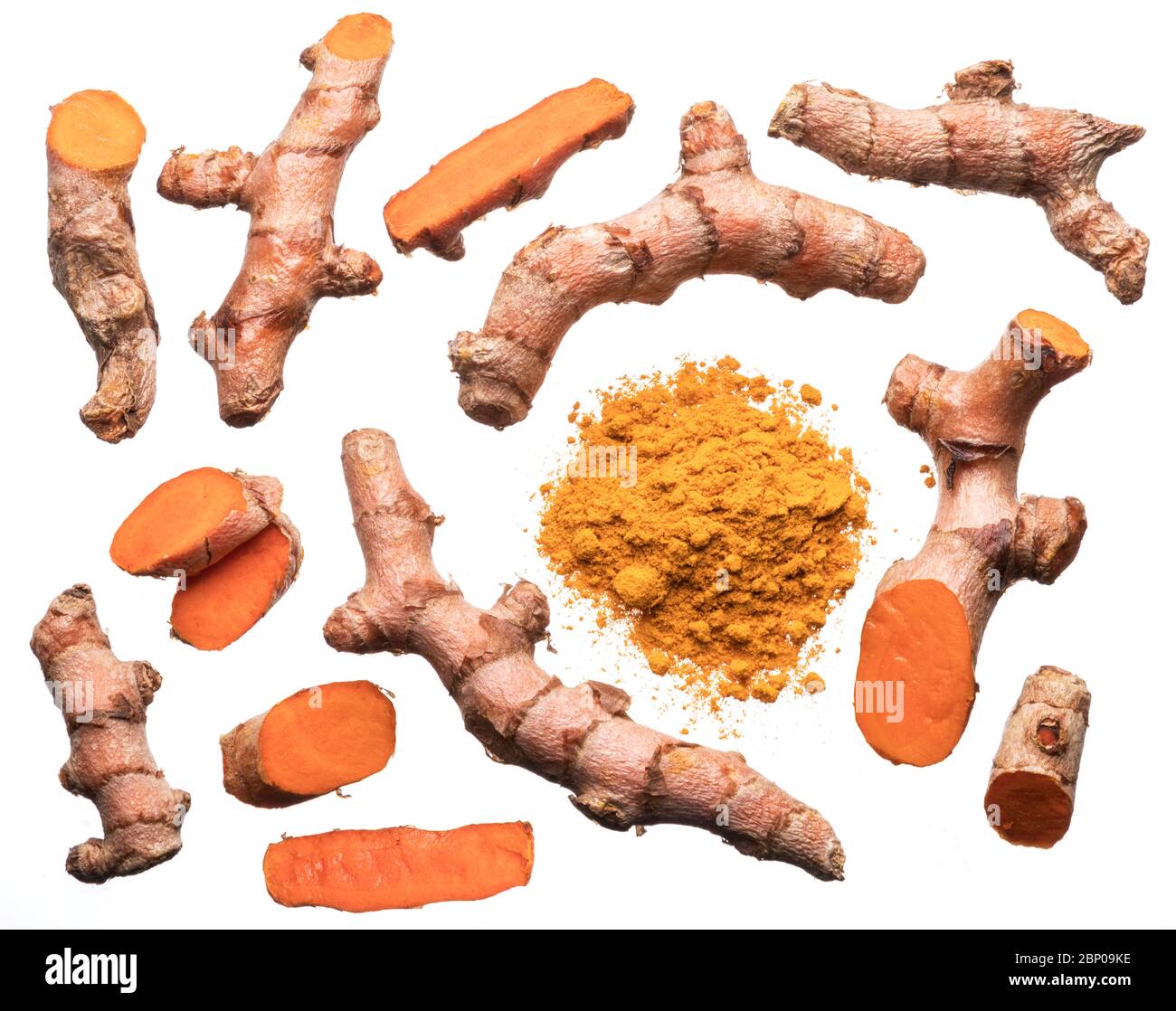 Fresh turmeric rhizome cuts and turmeric powder isolated on white ...