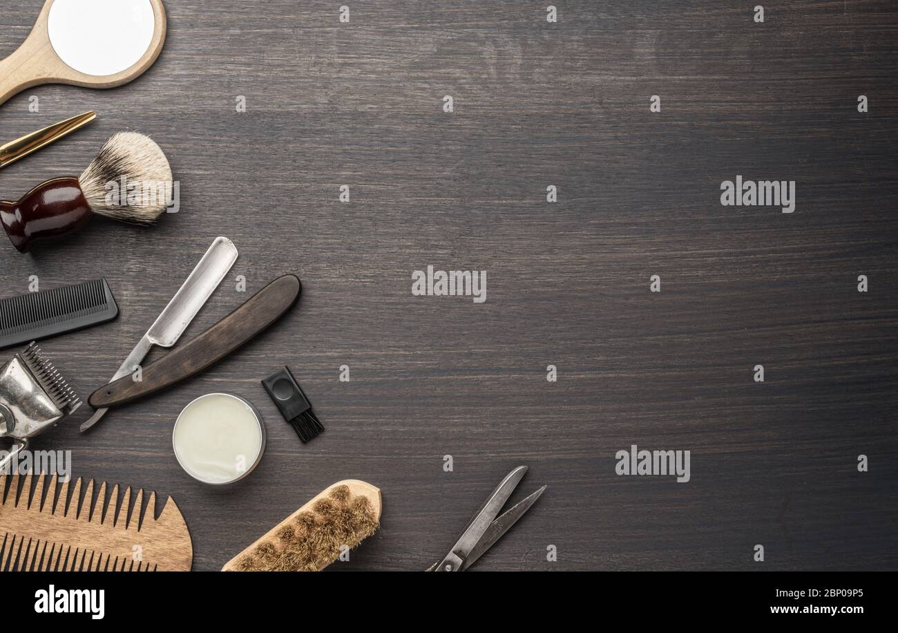 Classic grooming and hairdressing tools on wooden background. Top view ...