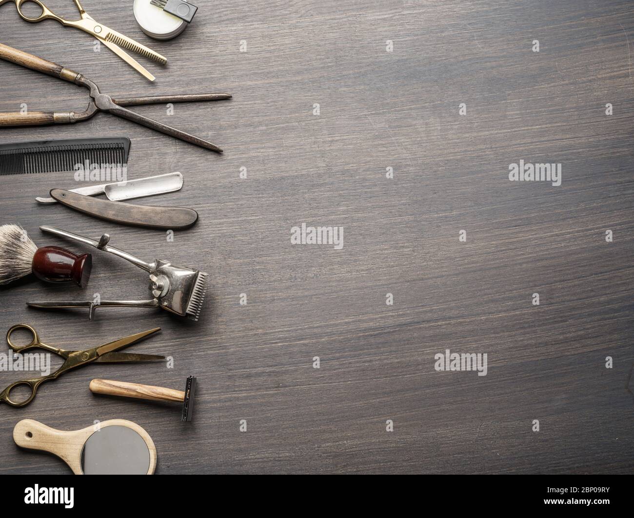 Classic grooming and hairdressing tools on wooden background. Top view ...