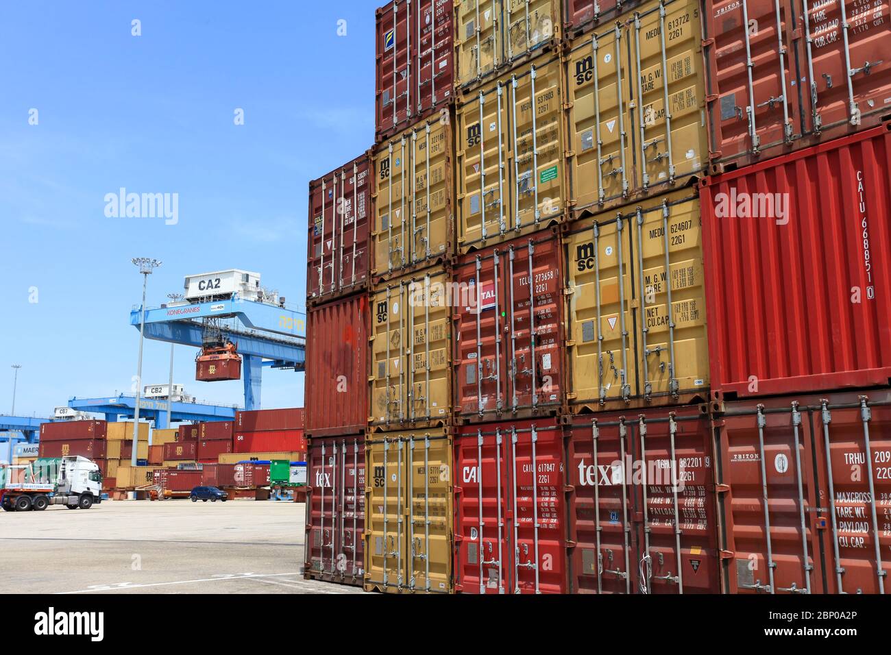 Various container brands stacked in a holding platform Stock Photo - Alamy