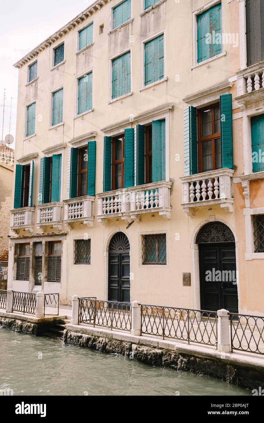 Closeup of the facade of a building, on the streets of Venice, Italy ...