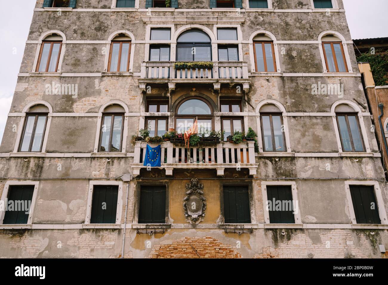 Brown brick stone wall, house facade in Italy, Venice, with old classic ...