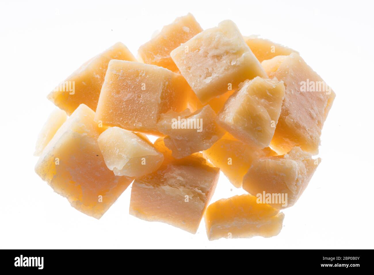 Parmesan cheese cubes isolated on white background Stock Photo - Alamy