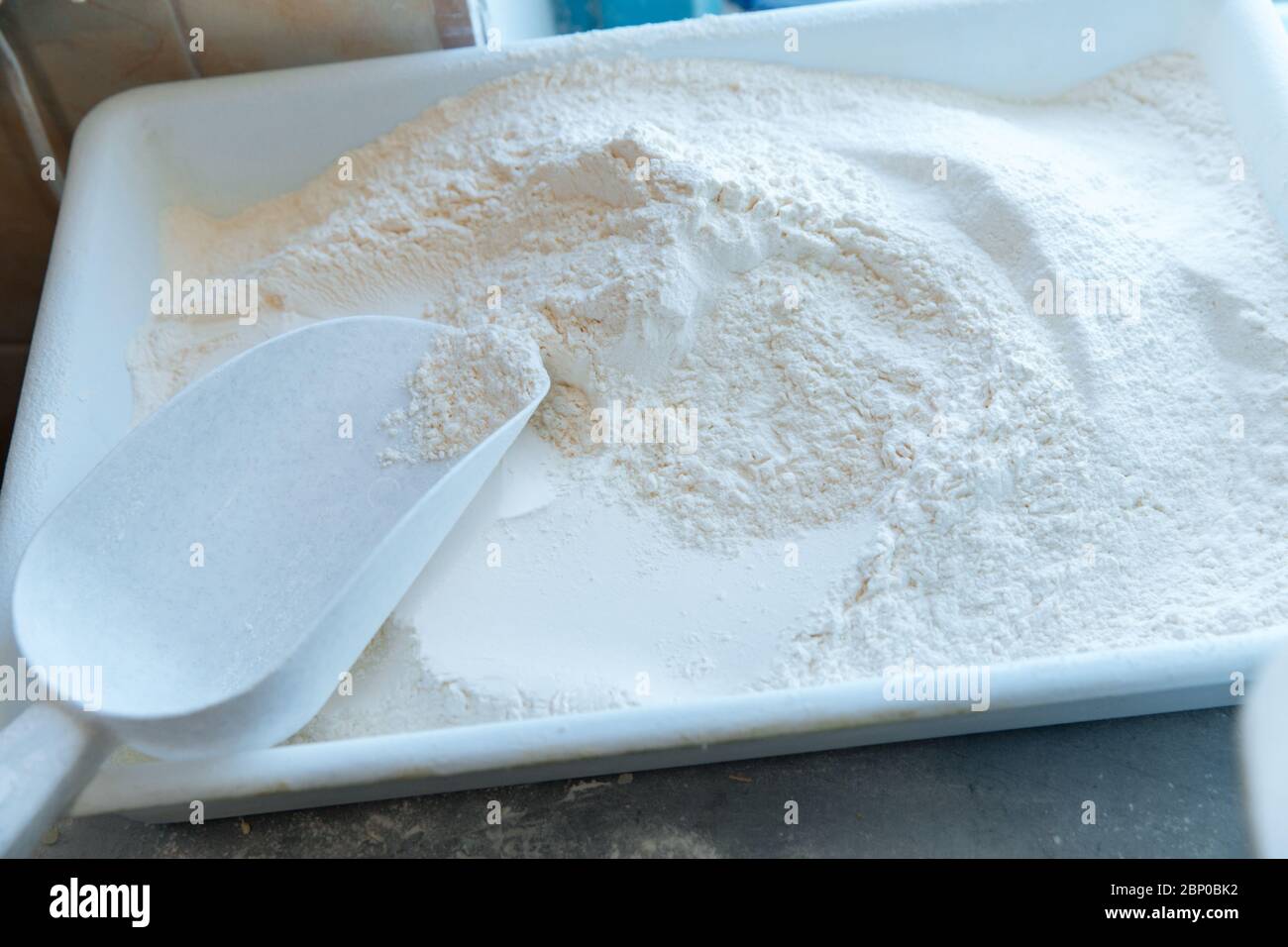 Kitchen, plastic transparent box with flour. Ingredient for cooking ...