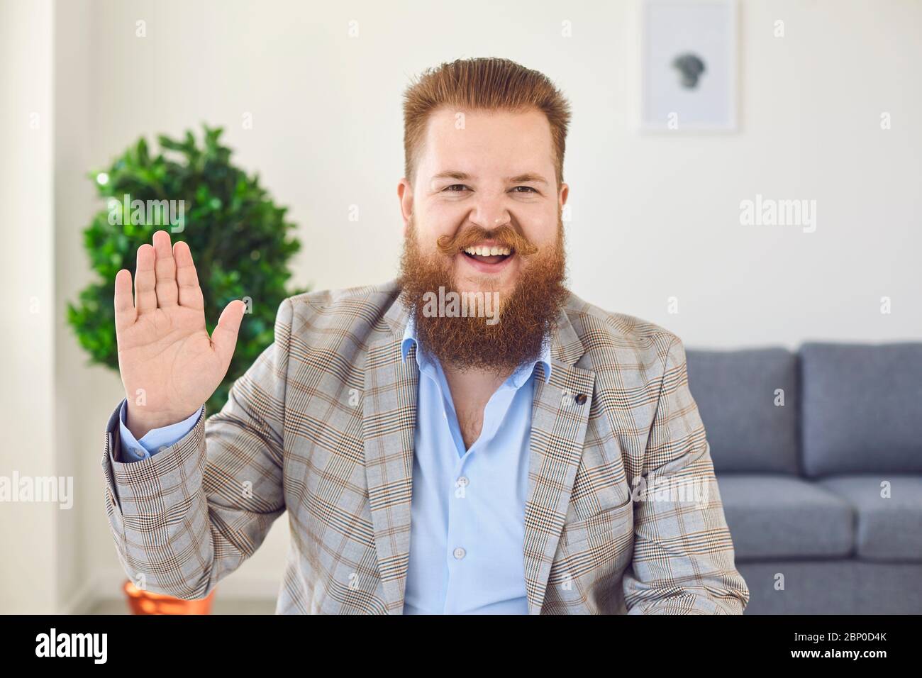 Online work communication video call home. A fat man with a beard ...