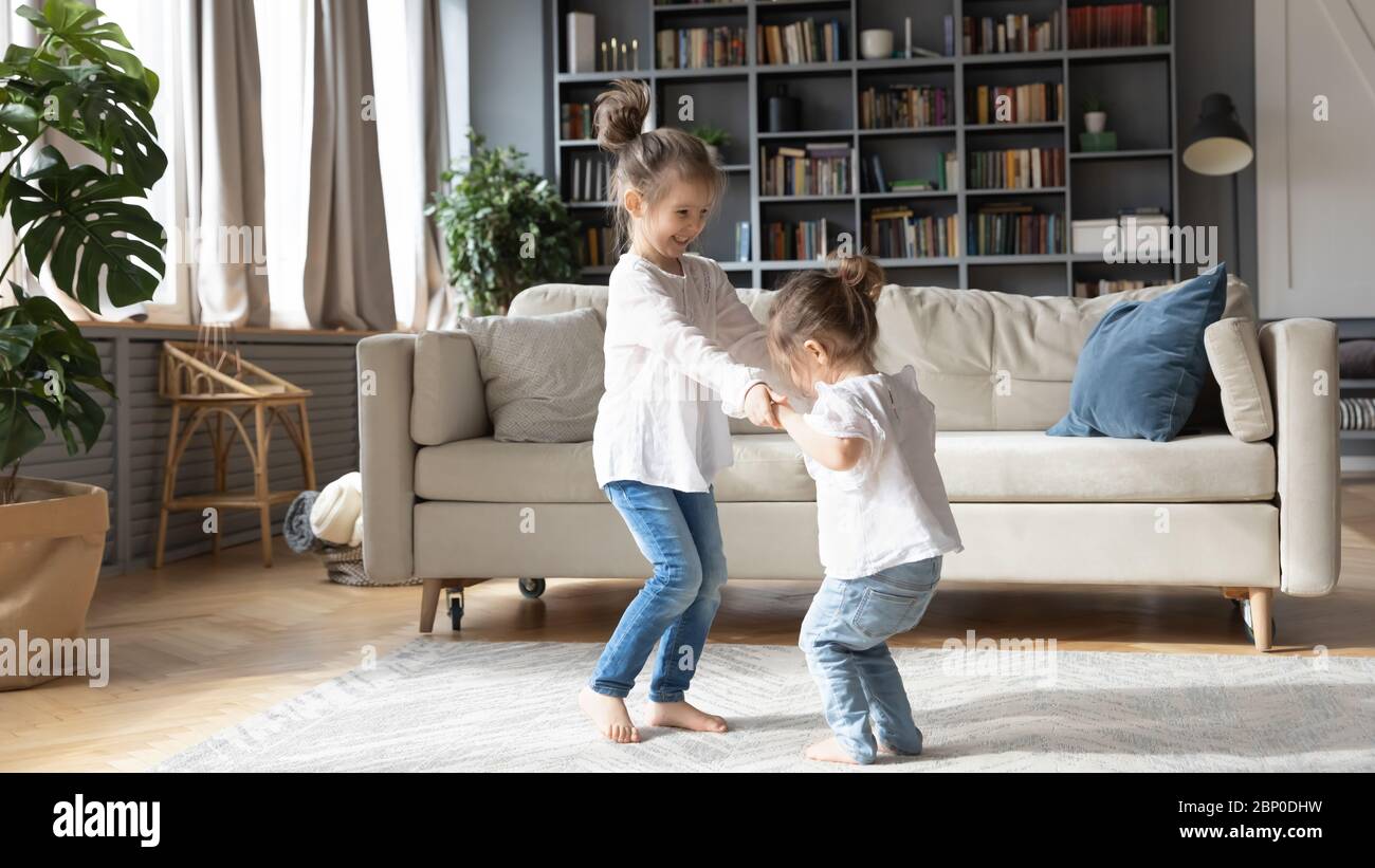 Cute little girls have fun dancing at home Stock Photo - Alamy