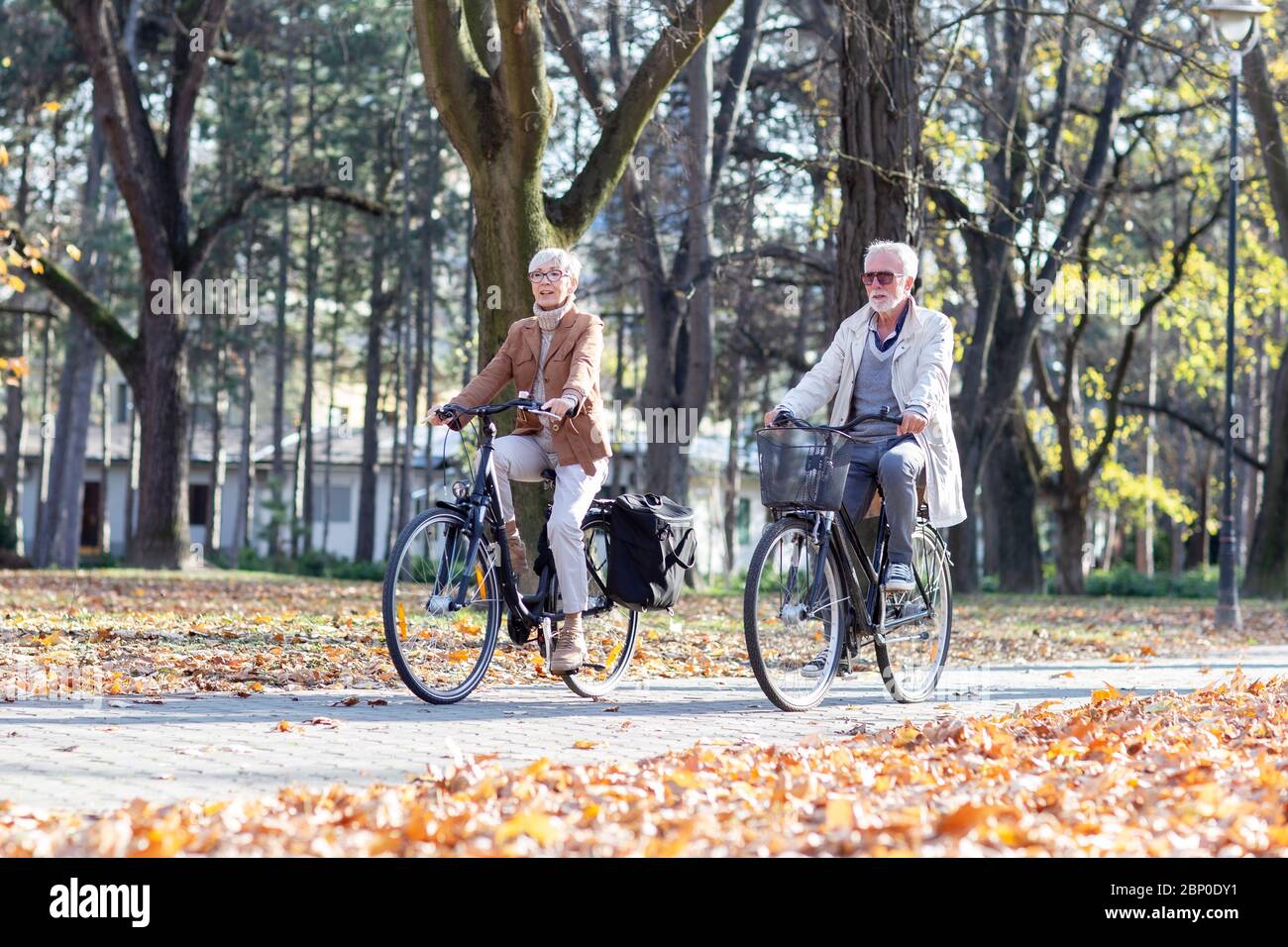 Elderly man riding bicycle bike ride exercise park cycle hi-res stock ...