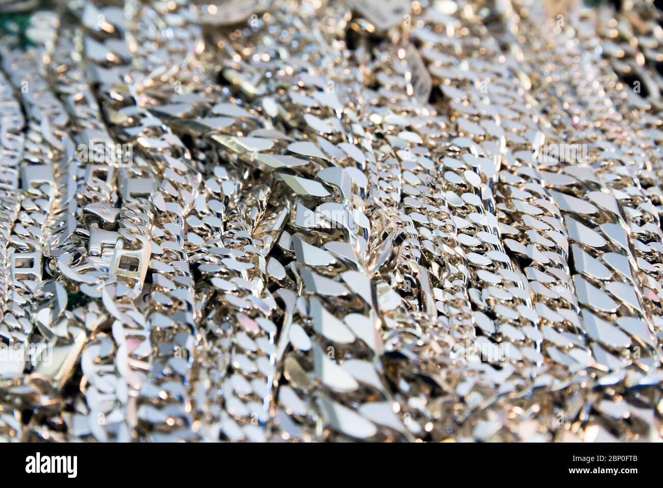 A bunch of silver chains close-up view Stock Photo - Alamy