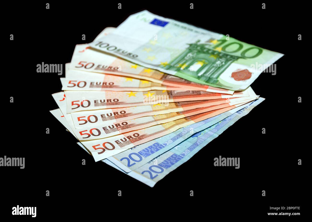 Shot of a selection of Euro notes against a black background Stock ...