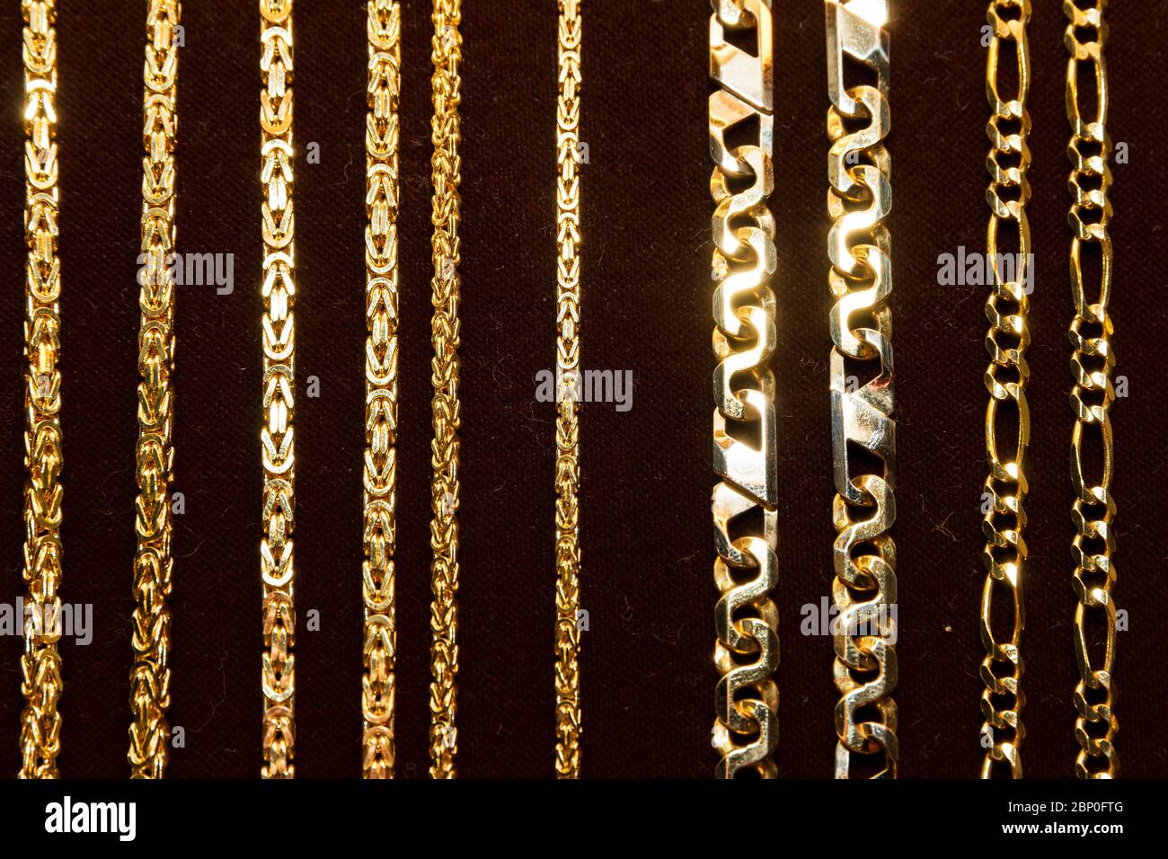 A collection of different types of heavy golden chains Stock Photo - Alamy