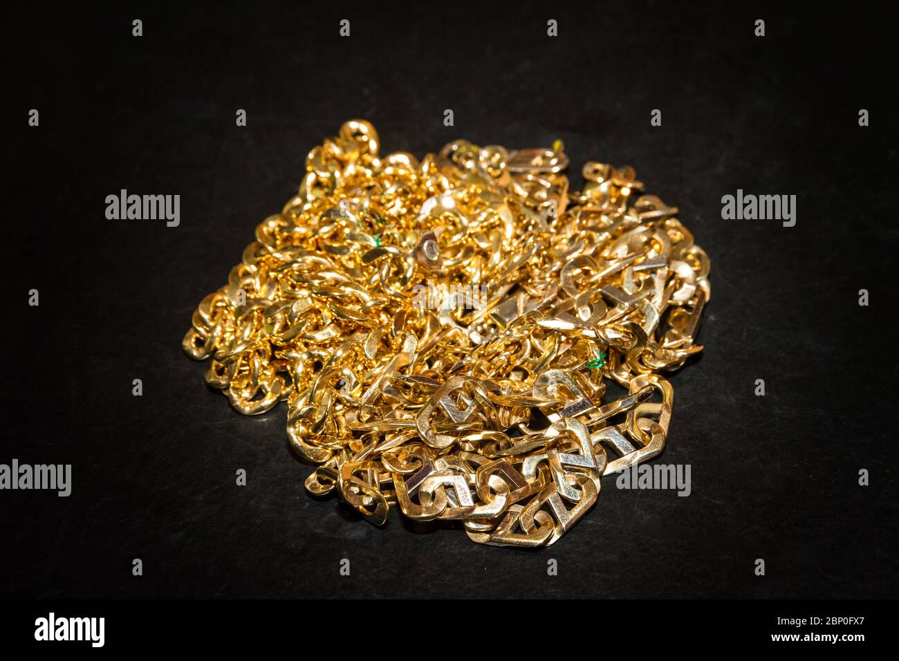 A collection of different types of heavy golden chains Stock Photo - Alamy