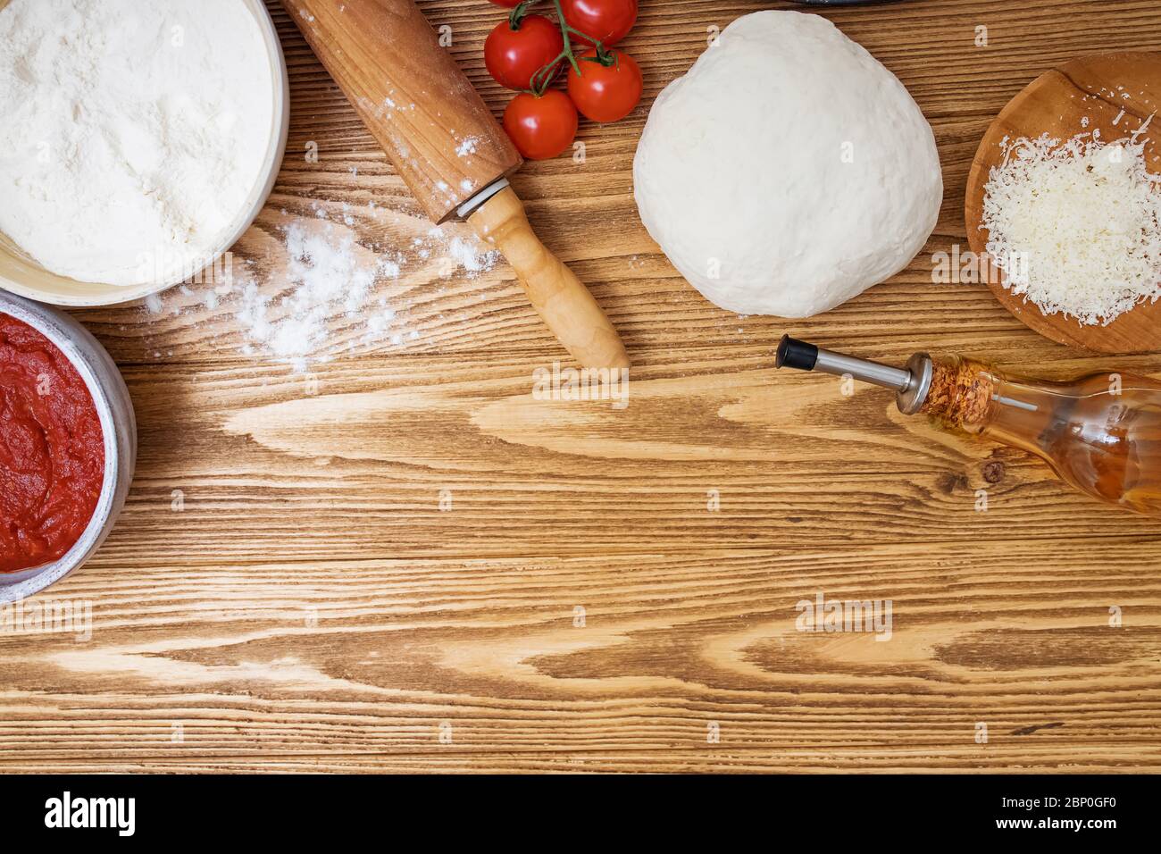 Pizza cooking. Top view with copy space Stock Photo - Alamy