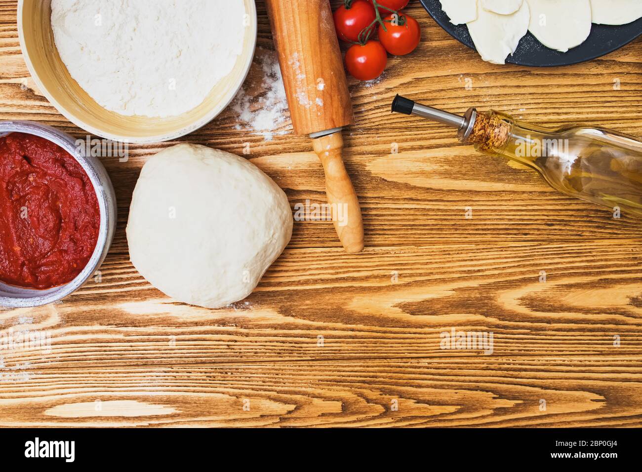 Pizza cooking. Top view with copy space Stock Photo - Alamy