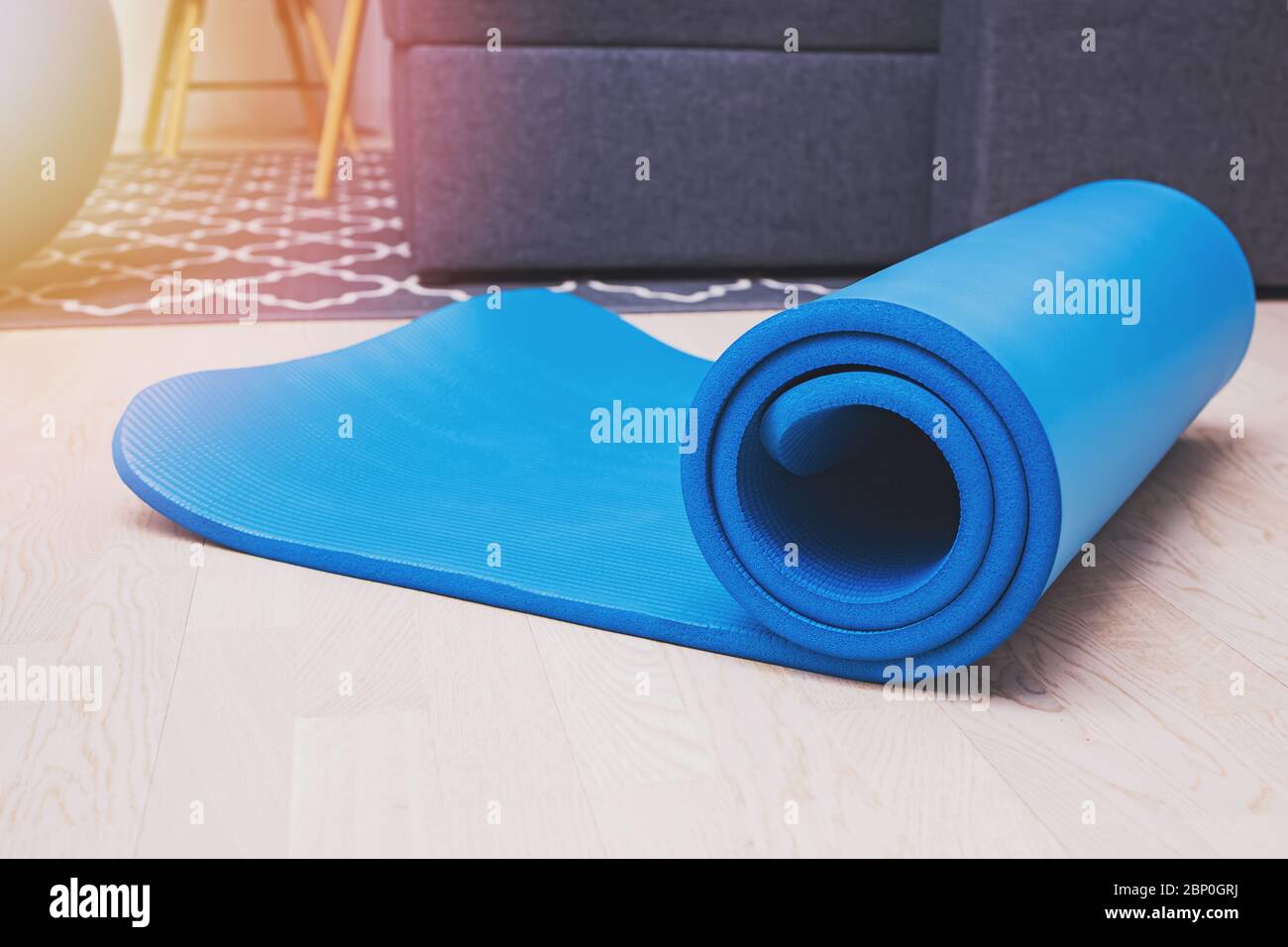 Yoga, fitness floor mat on the floor in modern living room interior ...