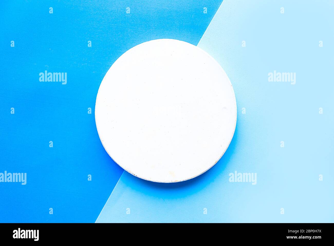 White round mockup blank on blue geometric background. Design concept ...