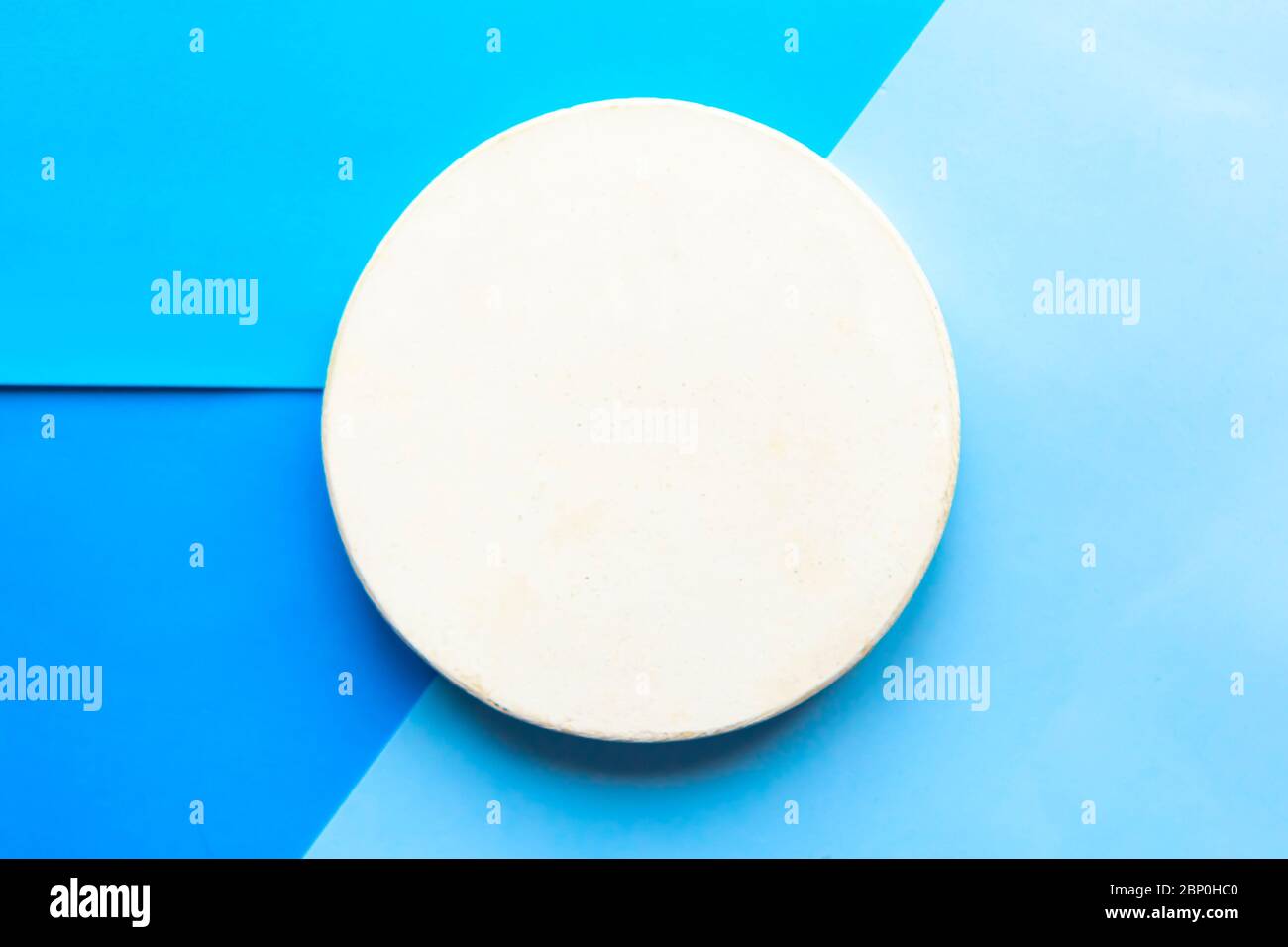 White round mockup blank on blue geometric background. Design concept ...
