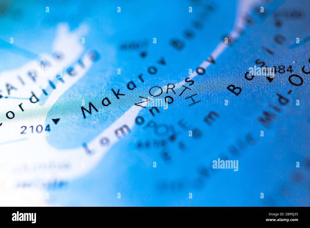 Shallow depth of field focus on geographical map location of north pole ...