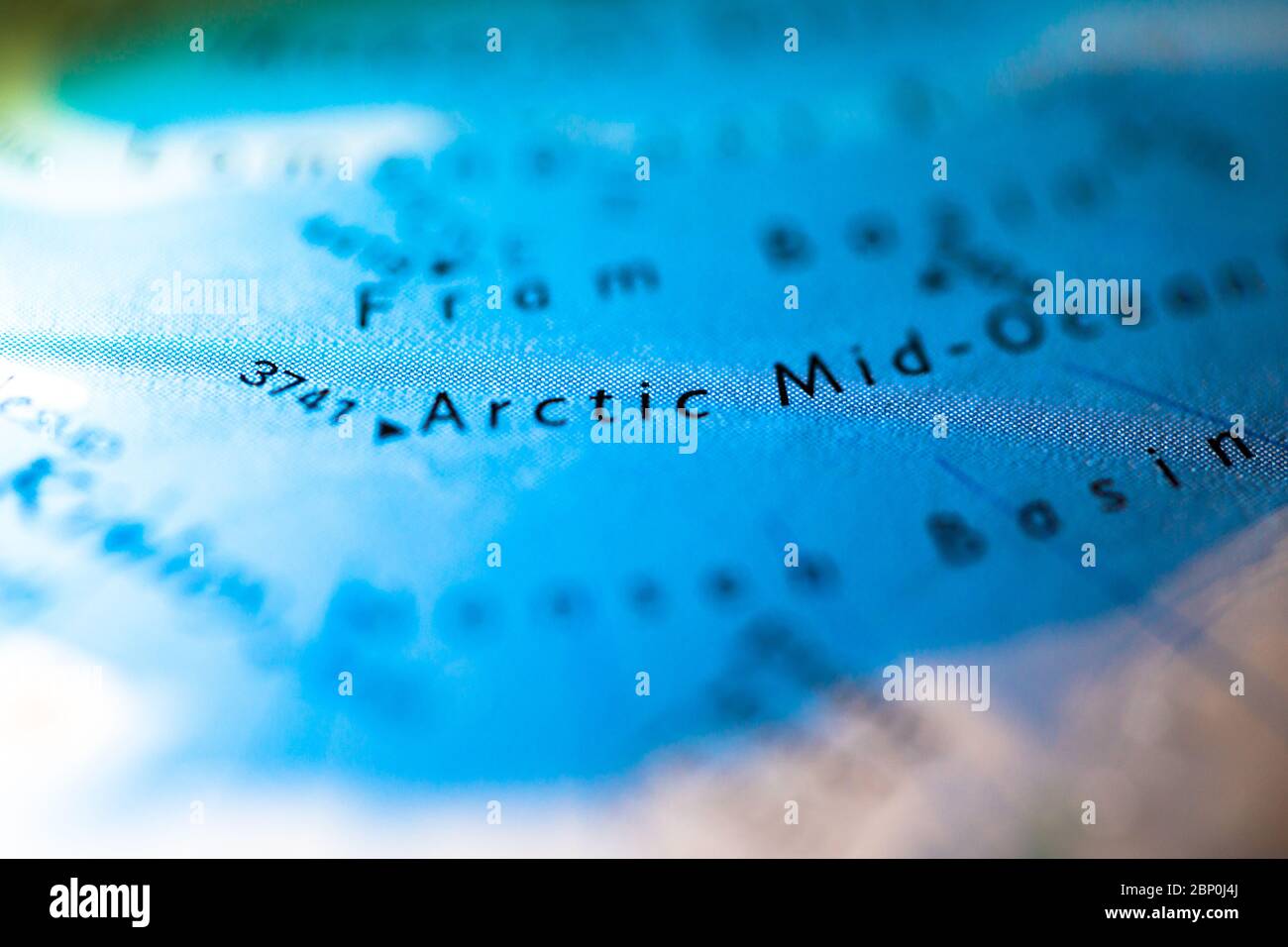 Shallow depth of field focus on geographical map location of north pole ...