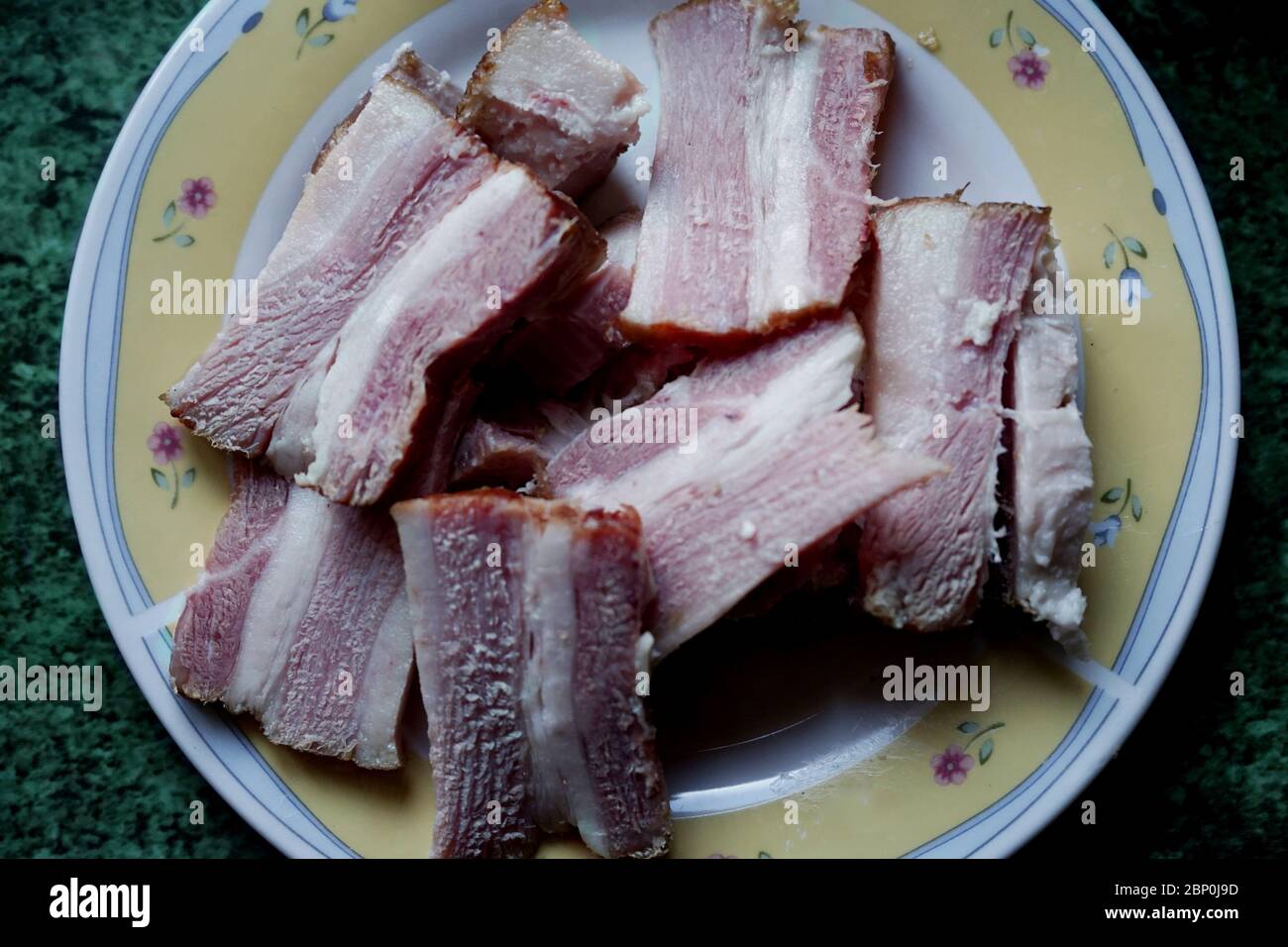 Raw bacon on a plate. Food photography Stock Photo - Alamy