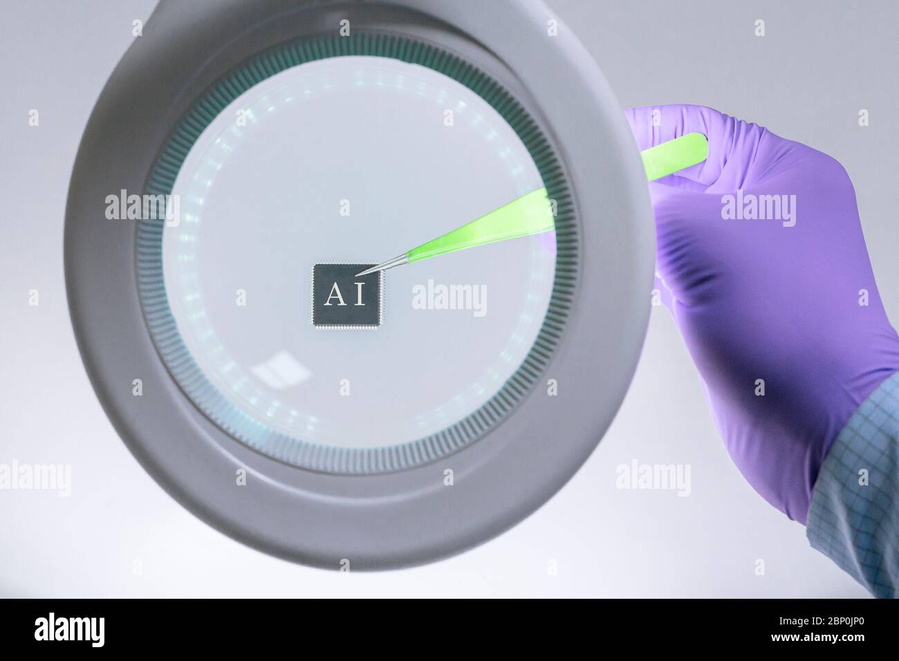 Hand in glove holding microchip Artificial intelligence with pair of ...