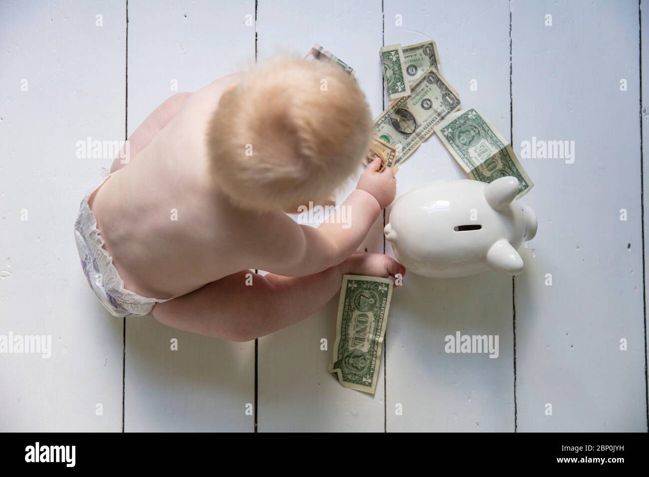 Money and baby hi-res stock photography and images - Alamy