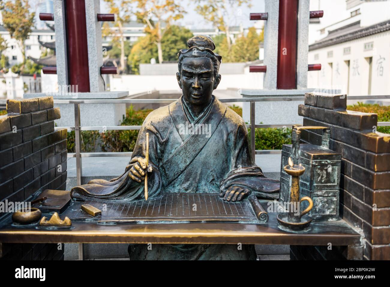 Statue of Acient Chinese Scholar writing on the bable on the bamboo ...