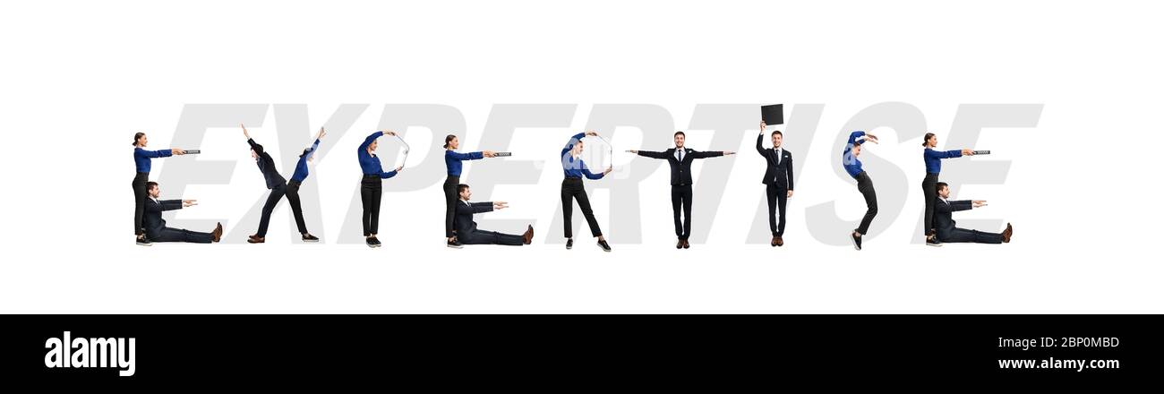 Group of people forming expertise word at studio Stock Photo - Alamy