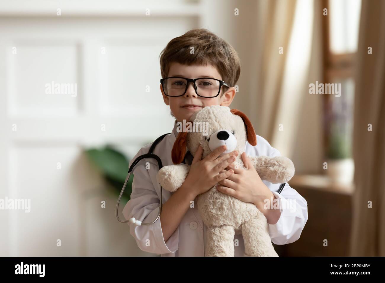 Portrait of cute little boy act as doctor in hospital Stock Photo - Alamy