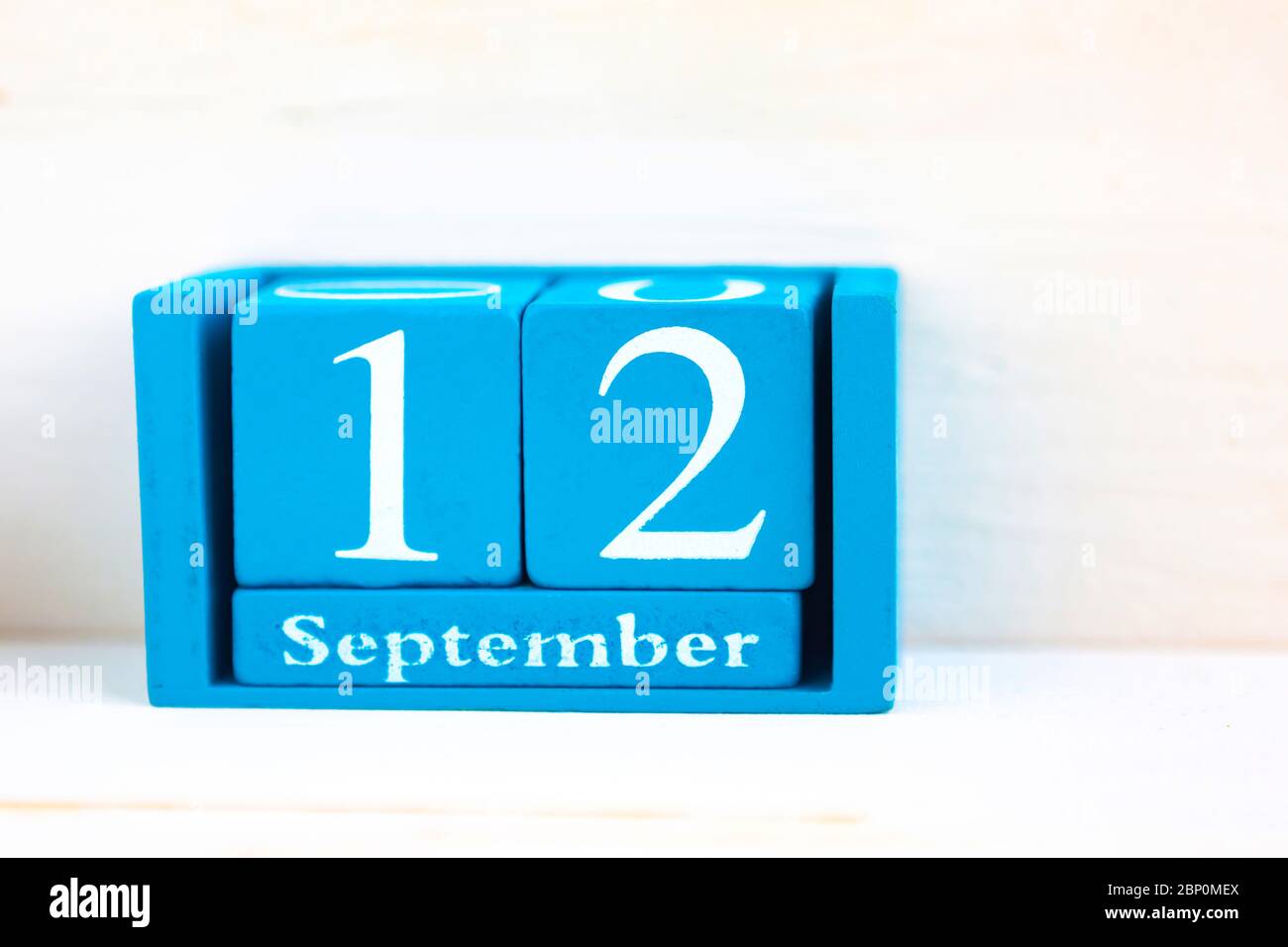 September 12, wooden background. Handmade wooden cube calendar with ...