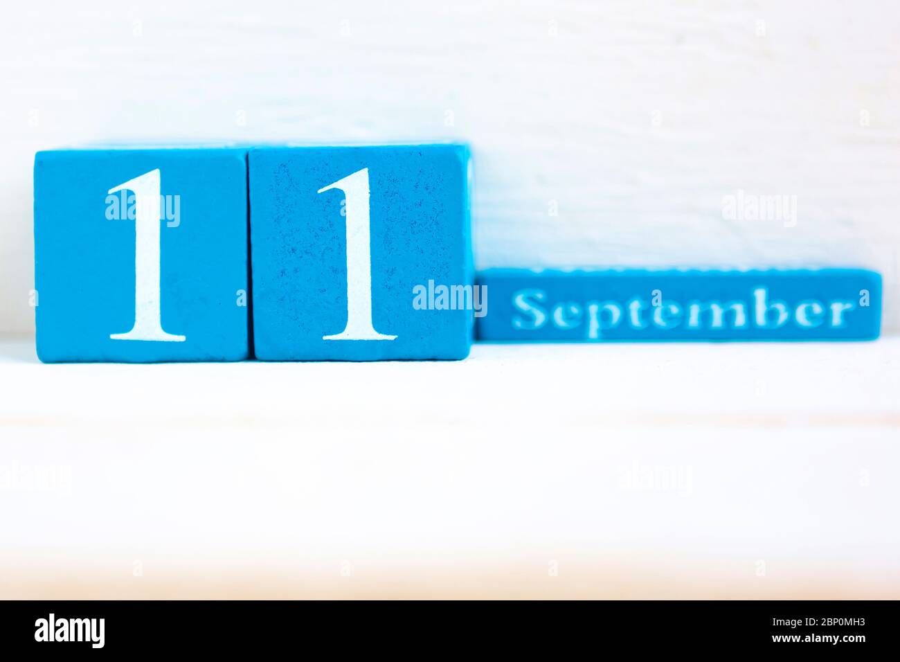 September 11, wooden background. Handmade wooden cube calendar with ...