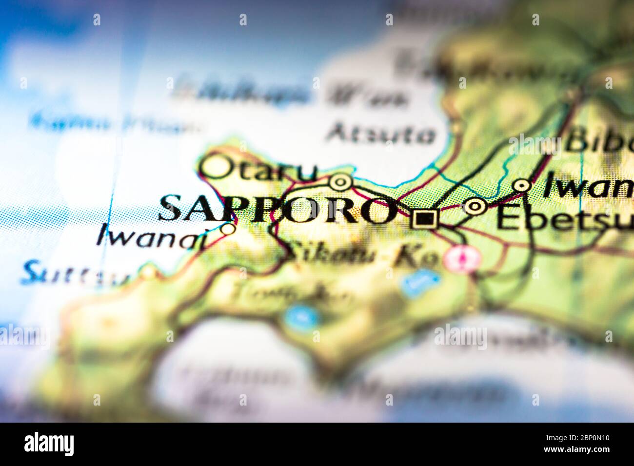 Shallow depth of field focus on geographical map location of Sapporo ...
