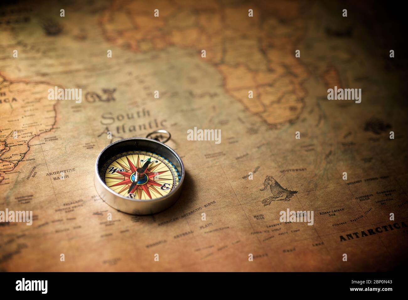 Vintage compass and old navigation map Stock Photo - Alamy