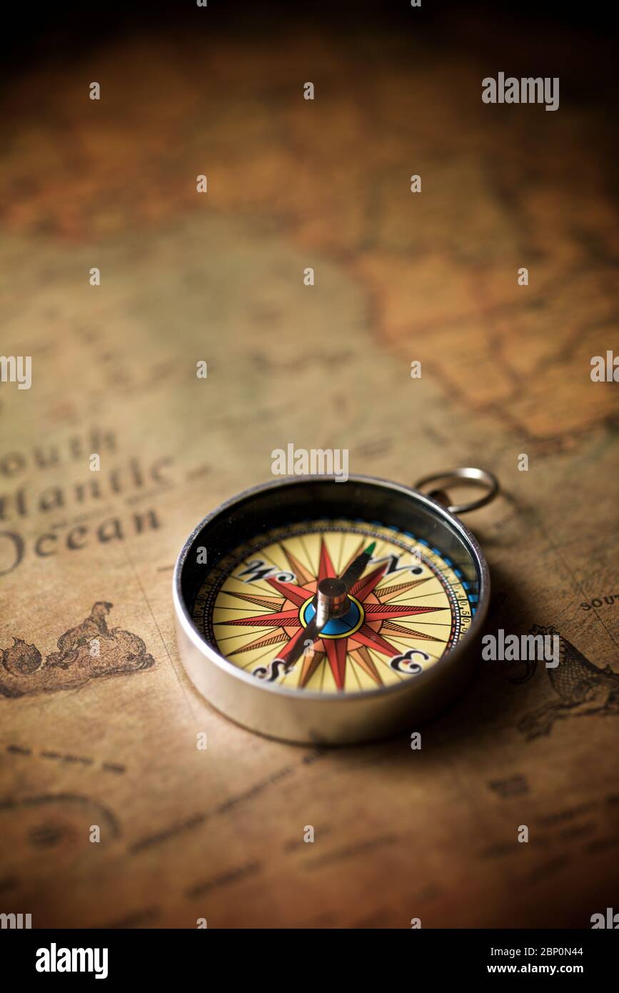 Vintage compass and old navigation map Stock Photo - Alamy