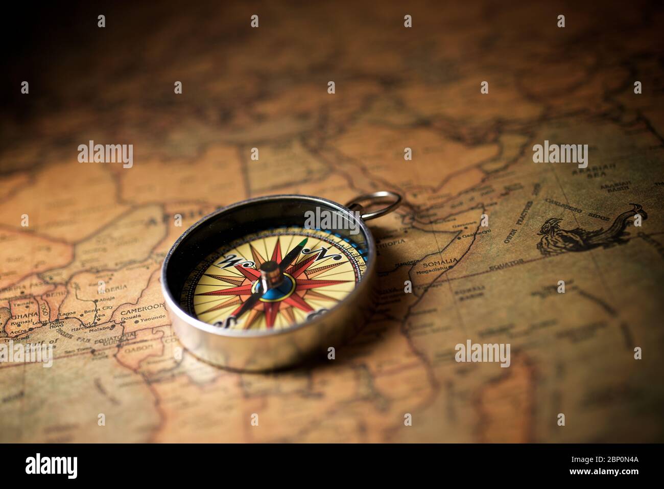 Vintage compass and old navigation map Stock Photo - Alamy