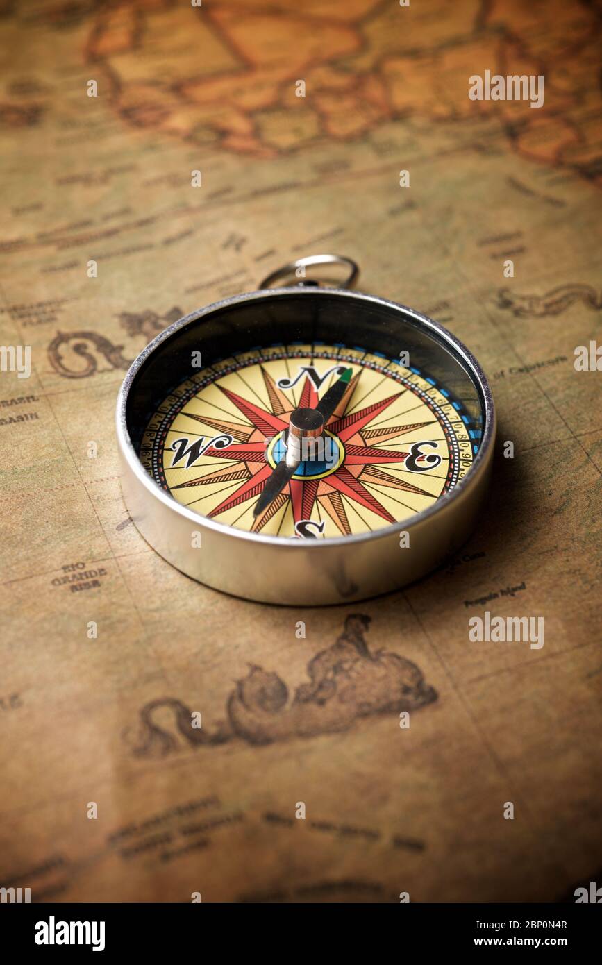Vintage compass and old navigation map Stock Photo - Alamy