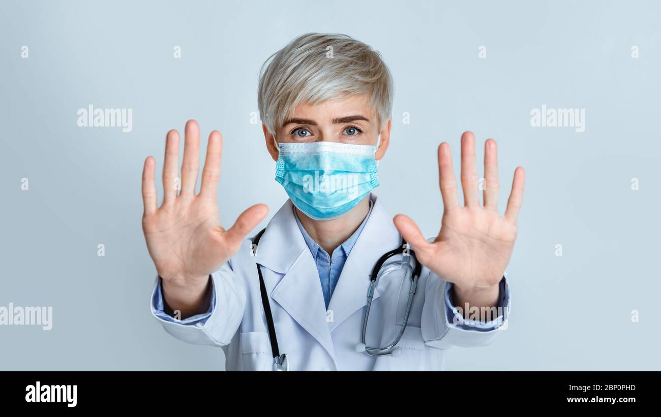 Stop disease concept. Doctor holds out her hands forward Stock Photo ...