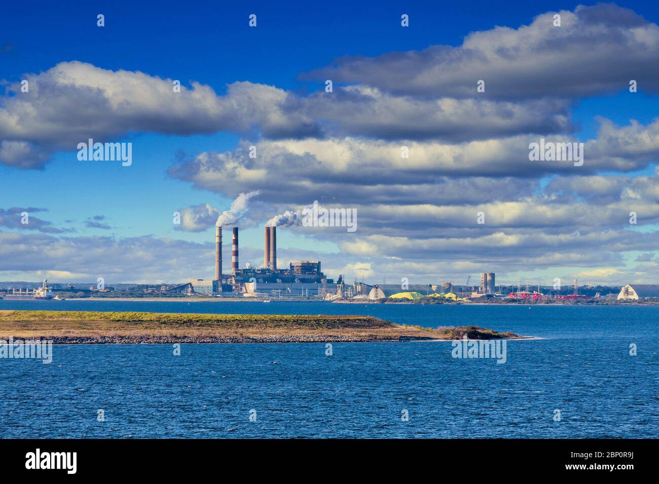 Industry Across Blue Harbor Stock Photo - Alamy