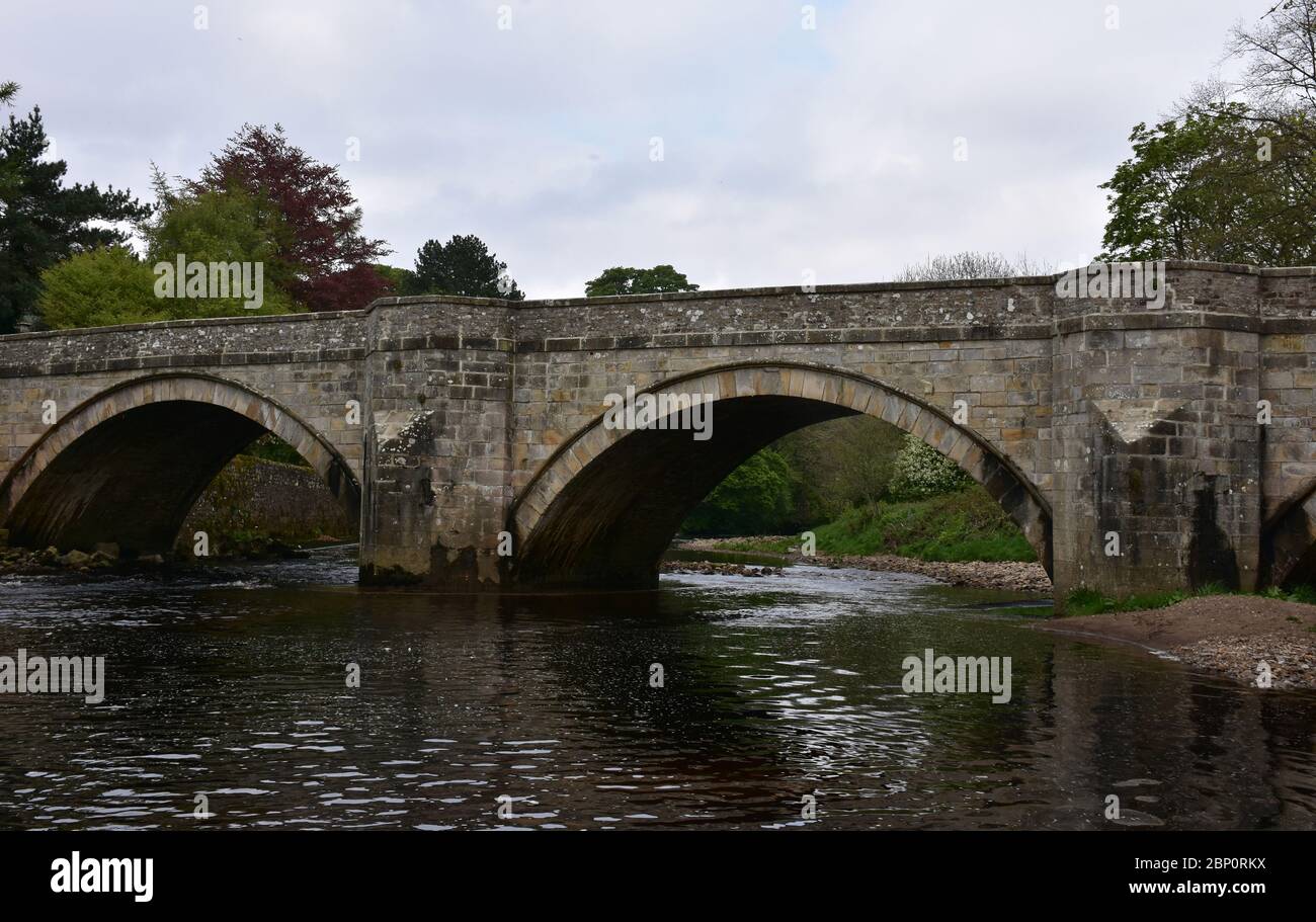Stone bridge with archways over a riverway Stock Photo - Alamy